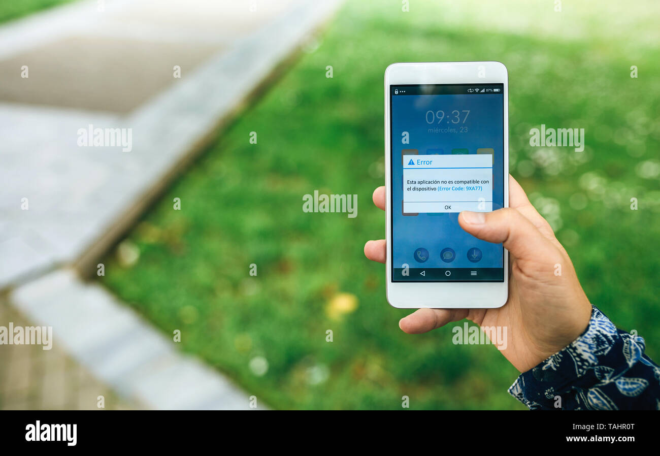 Hands holding phone with app update error text on screen Stock Photo ...