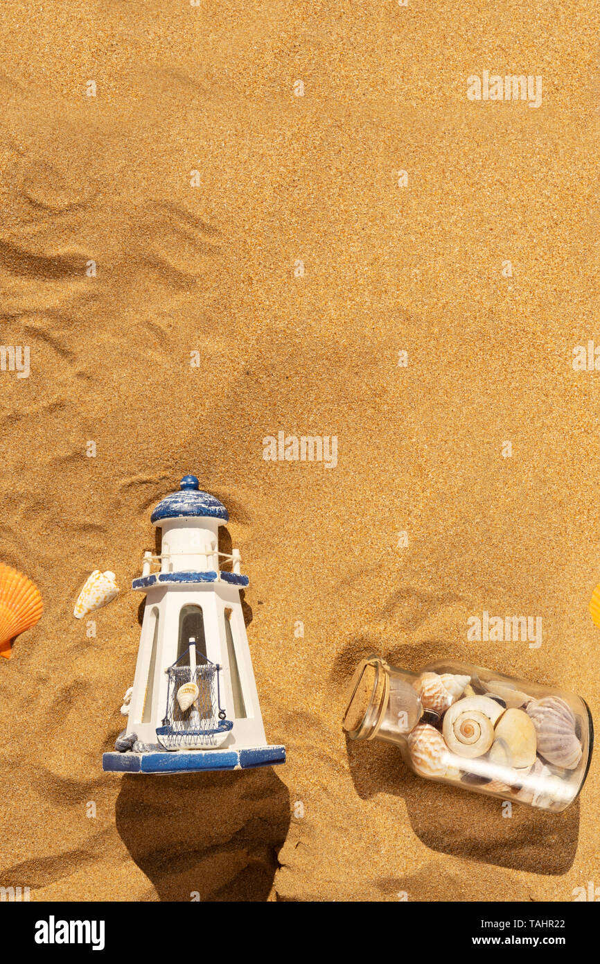 Summer sea still life with lighthouse on beach sand, top view flat lay ...