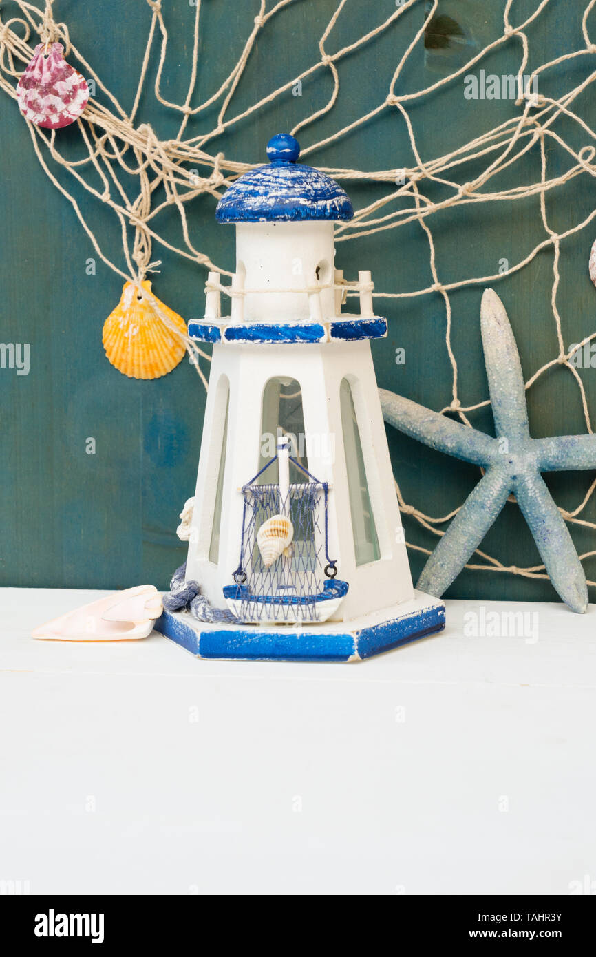 Summer sea still life with lighthouse, copy space on white background ...