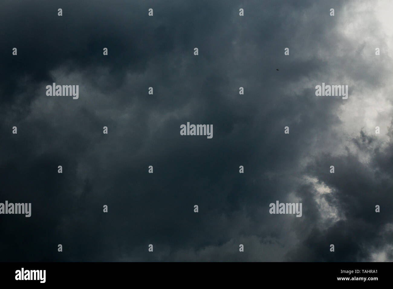 gray incoming storm clouds dark closeup backdrop, captured on 100 mm ...
