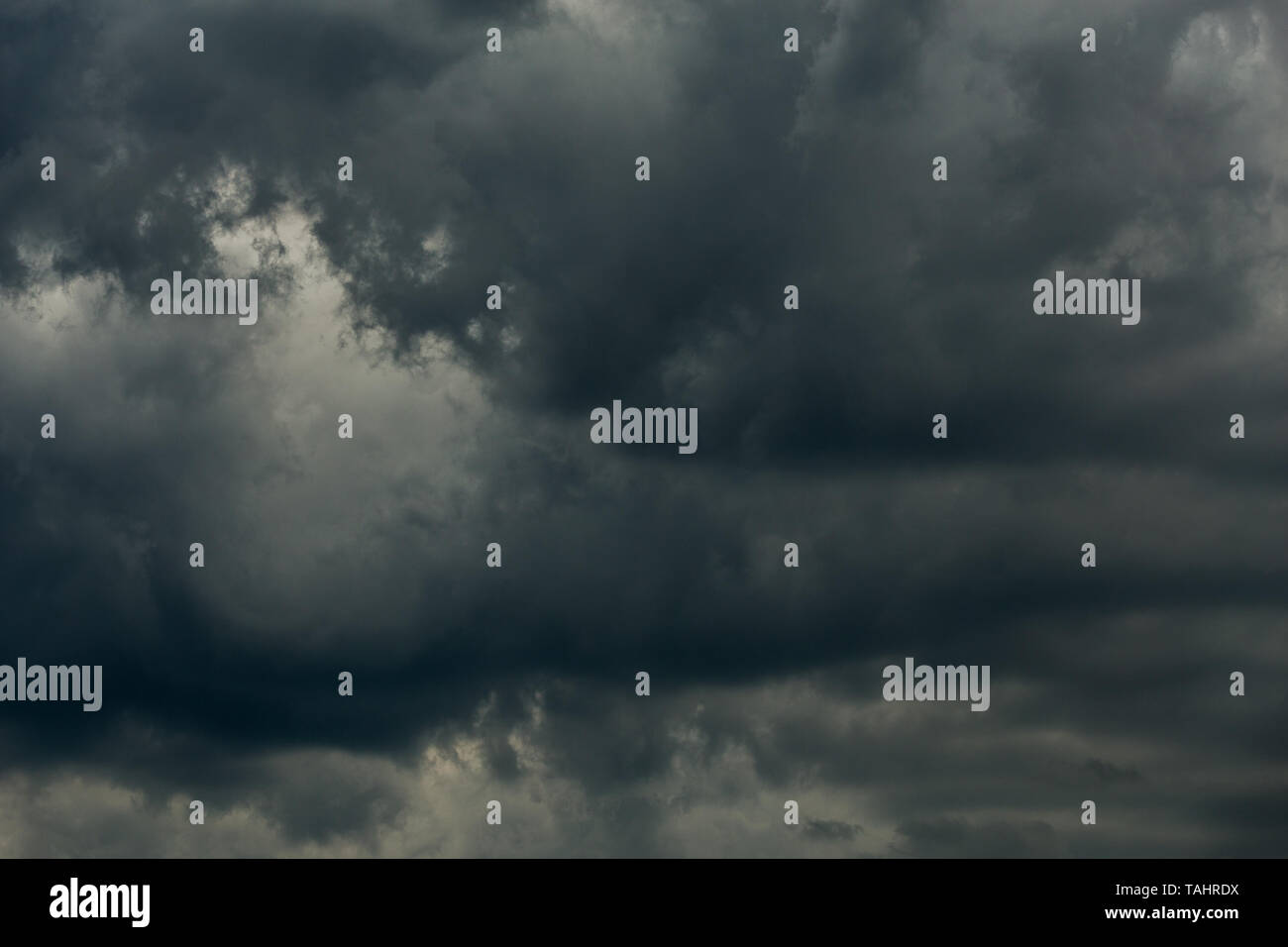 gray incoming storm clouds dark closeup backdrop, captured on 100 mm ...
