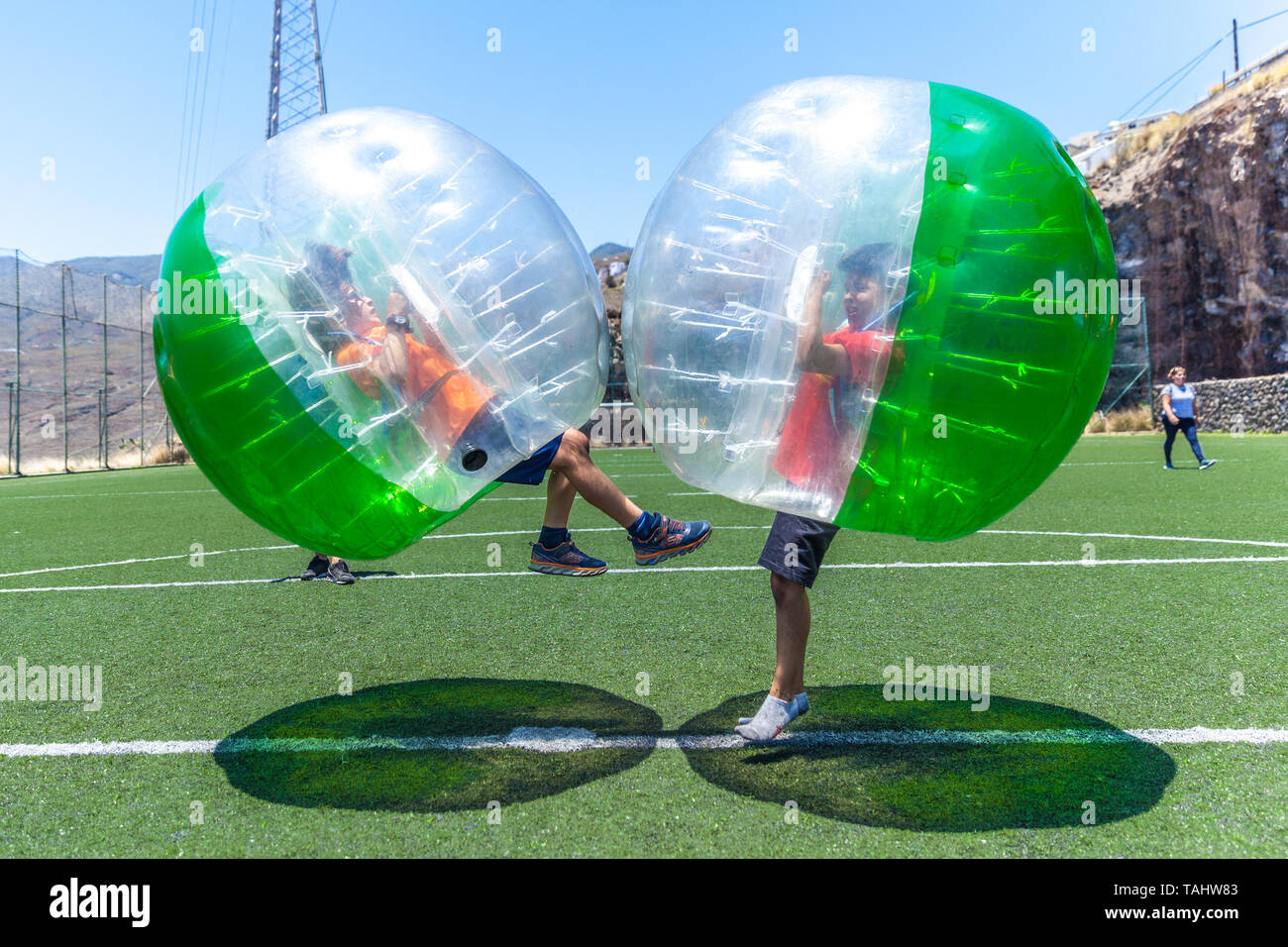 children playing with soccer bubbles Stock Photo - Alamy
