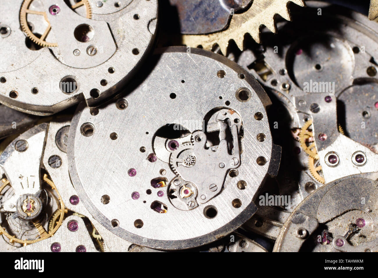 Broken movement of an old pocket watches background Stock Photo - Alamy