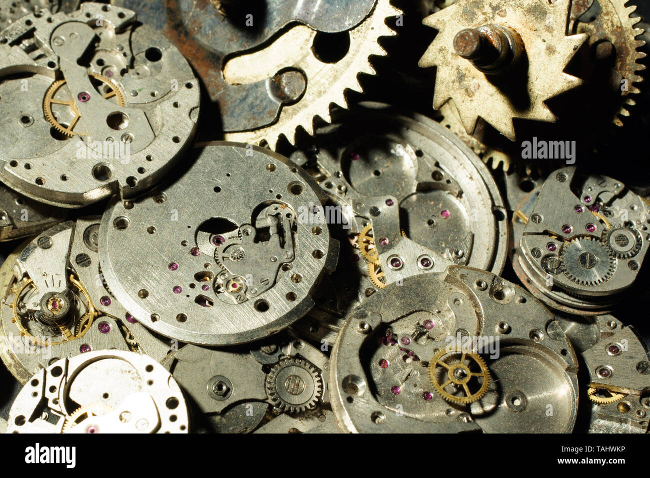 Broken movement of an old pocket watches background Stock Photo - Alamy