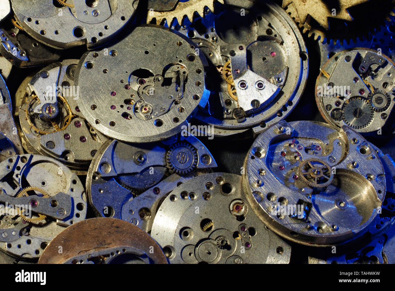 Broken movement of an old pocket watches background Stock Photo - Alamy