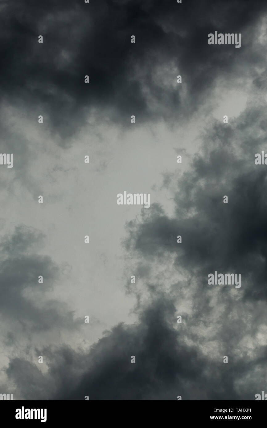 gray incoming storm clouds dark closeup vertical backdrop, captured on ...
