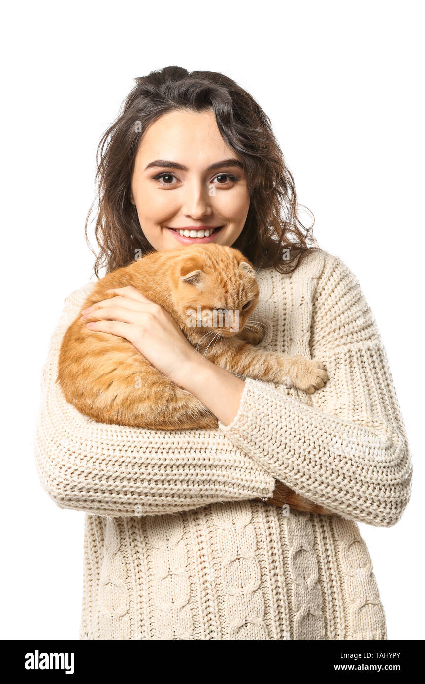 Young woman with her cute funny cat on white background Stock Photo - Alamy