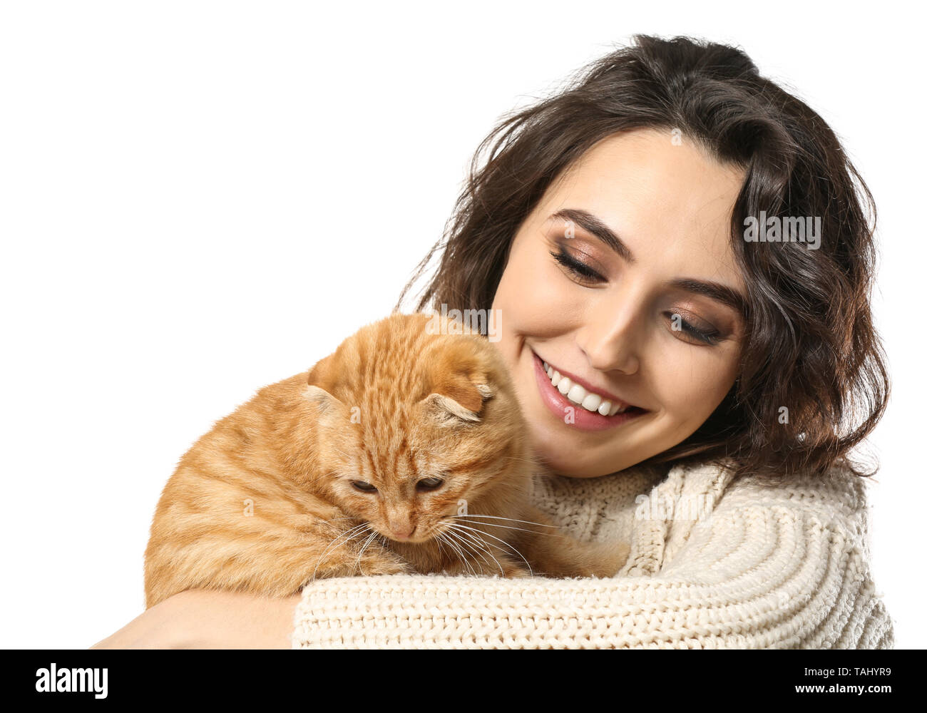 Young woman with her cute funny cat on white background Stock Photo - Alamy