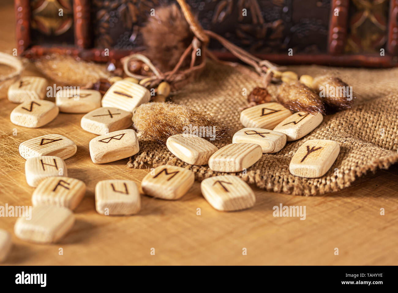 Handmade scandinavian wooden runes on a wooden vintage background ...
