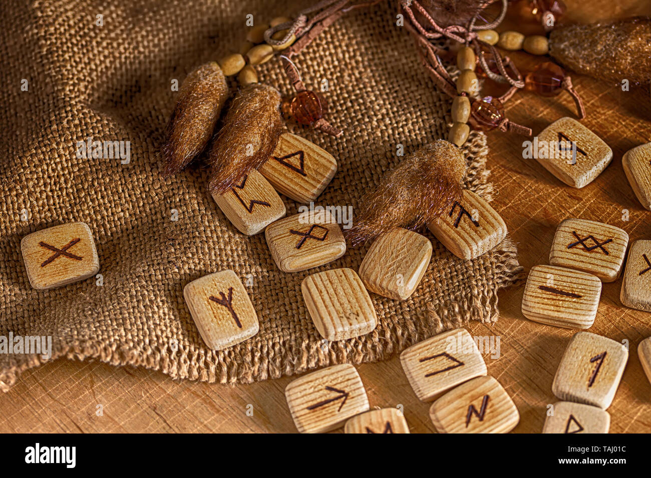 Handmade scandinavian wooden runes on a wooden vintage background ...