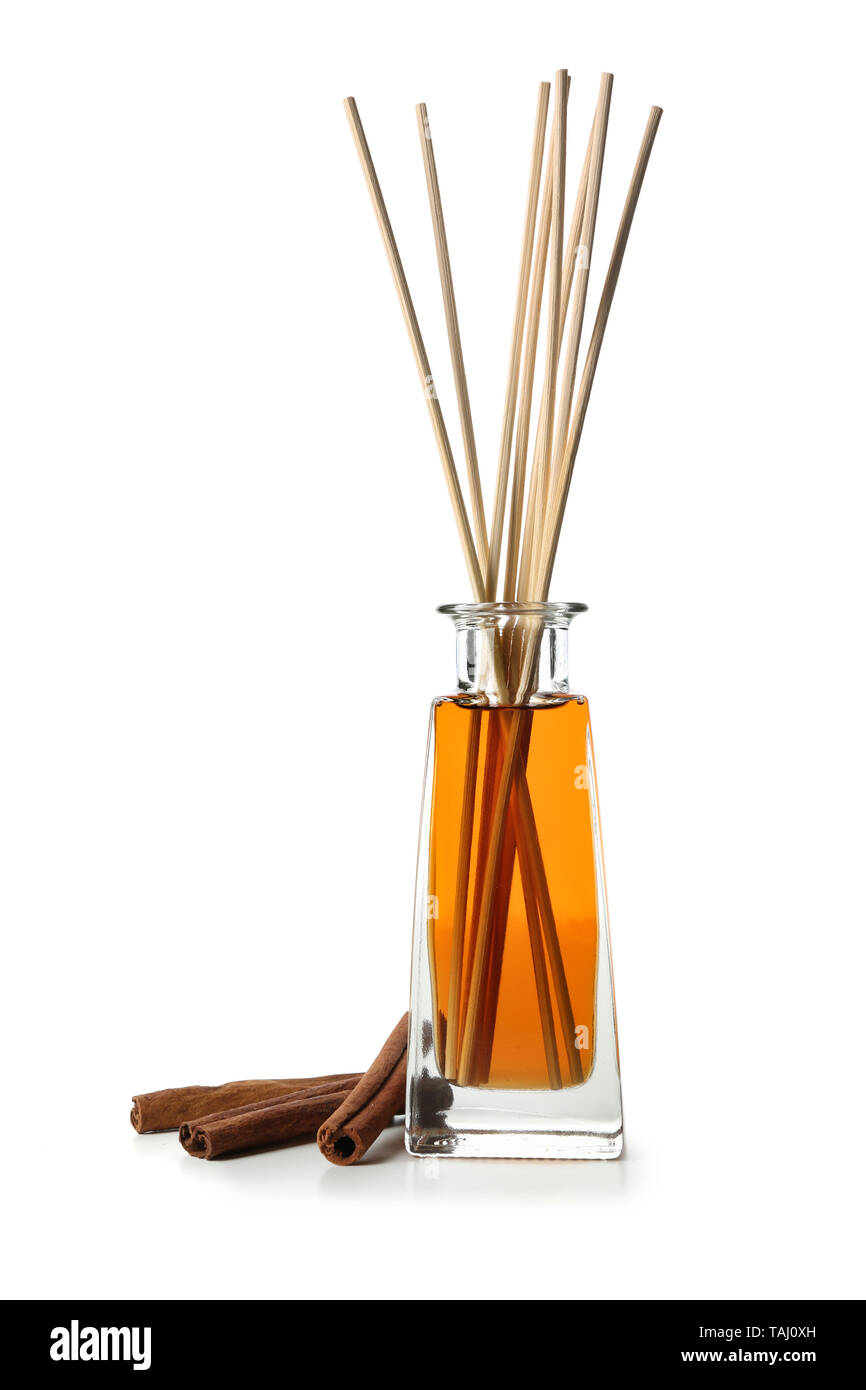 Cinnamon reed diffuser on white background Stock Photo - Alamy
