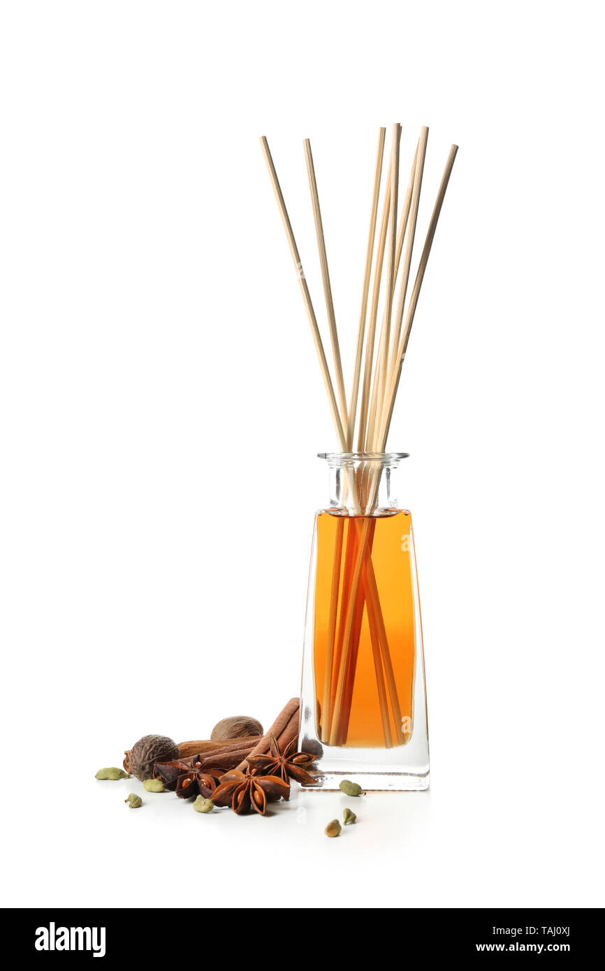 Reed diffuser and spices on white background Stock Photo - Alamy