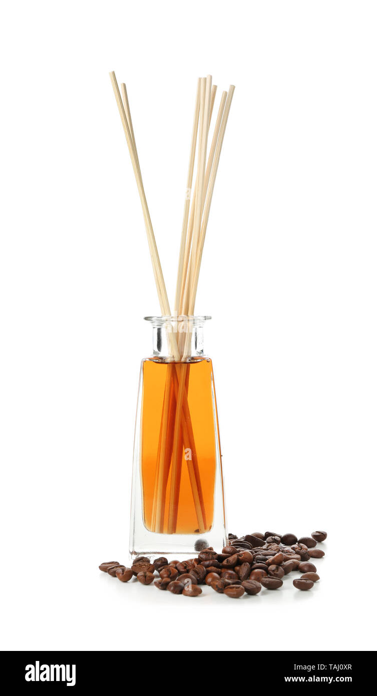 Reed diffuser and coffee beans on white background Stock Photo - Alamy