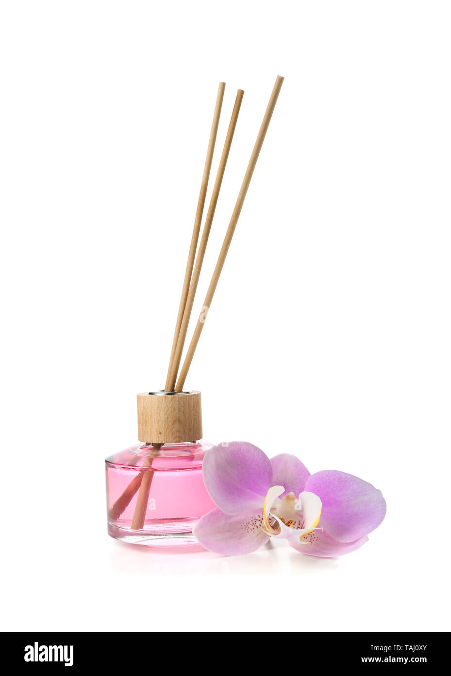 Reed diffuser and flower on white background Stock Photo - Alamy
