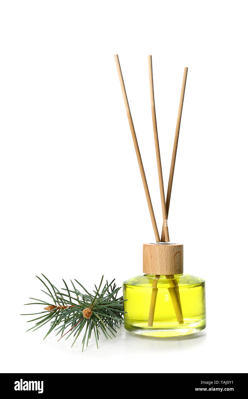 Reed diffuser and coniferous branch on white background Stock Photo - Alamy