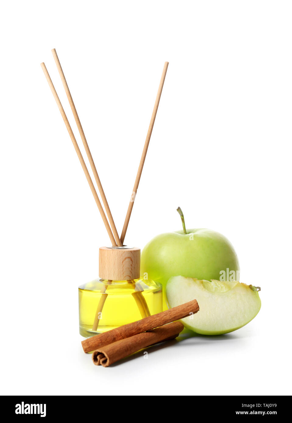 Reed diffuser, apple and cinnamon on white background Stock Photo - Alamy