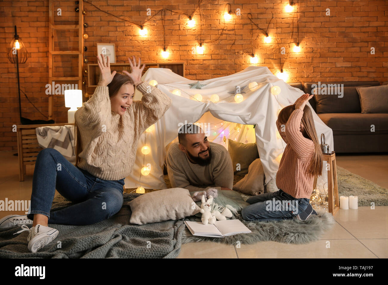 Happy family spending time at home Stock Photo - Alamy