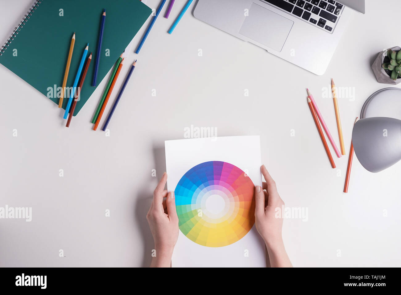 Female graphic designer with color palette on white background Stock ...