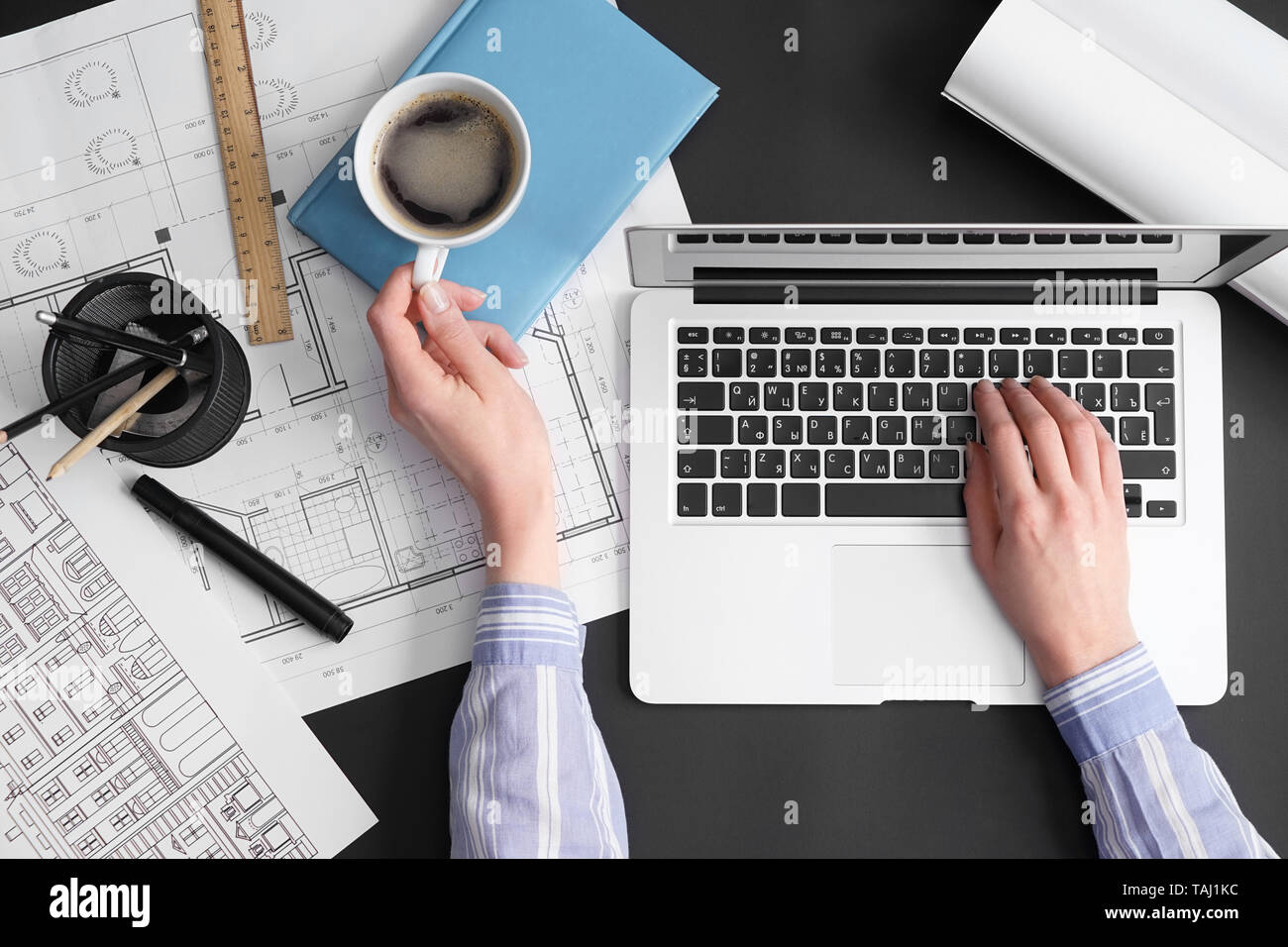 Female engineer working on dark background Stock Photo - Alamy