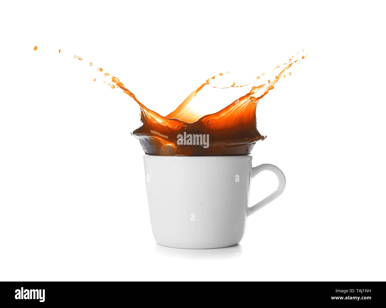 Splash of coffee in cup on white background Stock Photo - Alamy