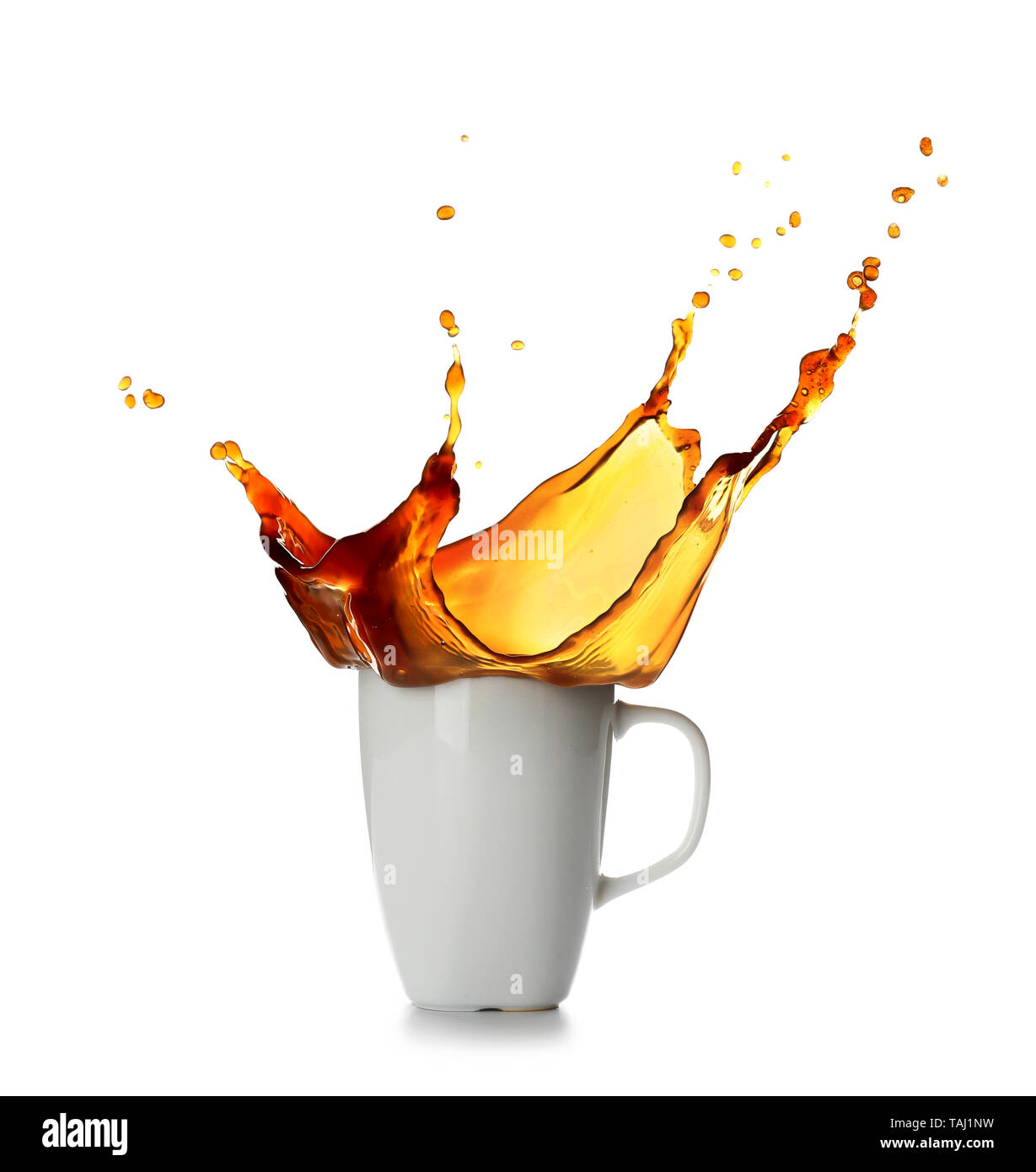 Splash of coffee in cup on white background Stock Photo - Alamy