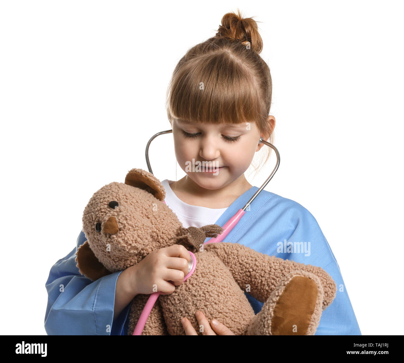 Portrait of cute little doctor with stethoscope and teddy bear on white ...
