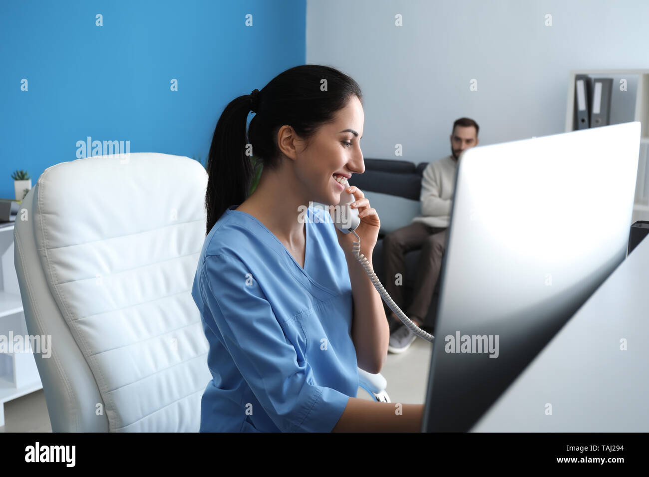 Medical receptionist phone hi-res stock photography and images - Alamy