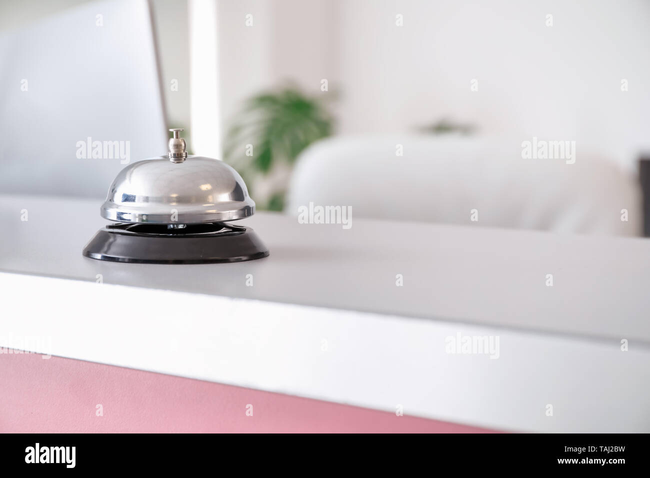 Service bell on reception desk in hotel Stock Photo - Alamy