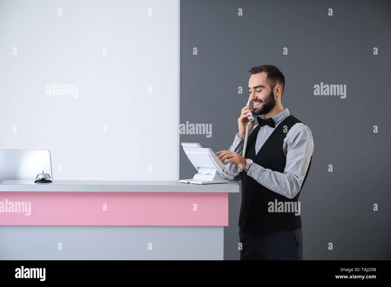 Man hotel phone counter hi-res stock photography and images - Alamy