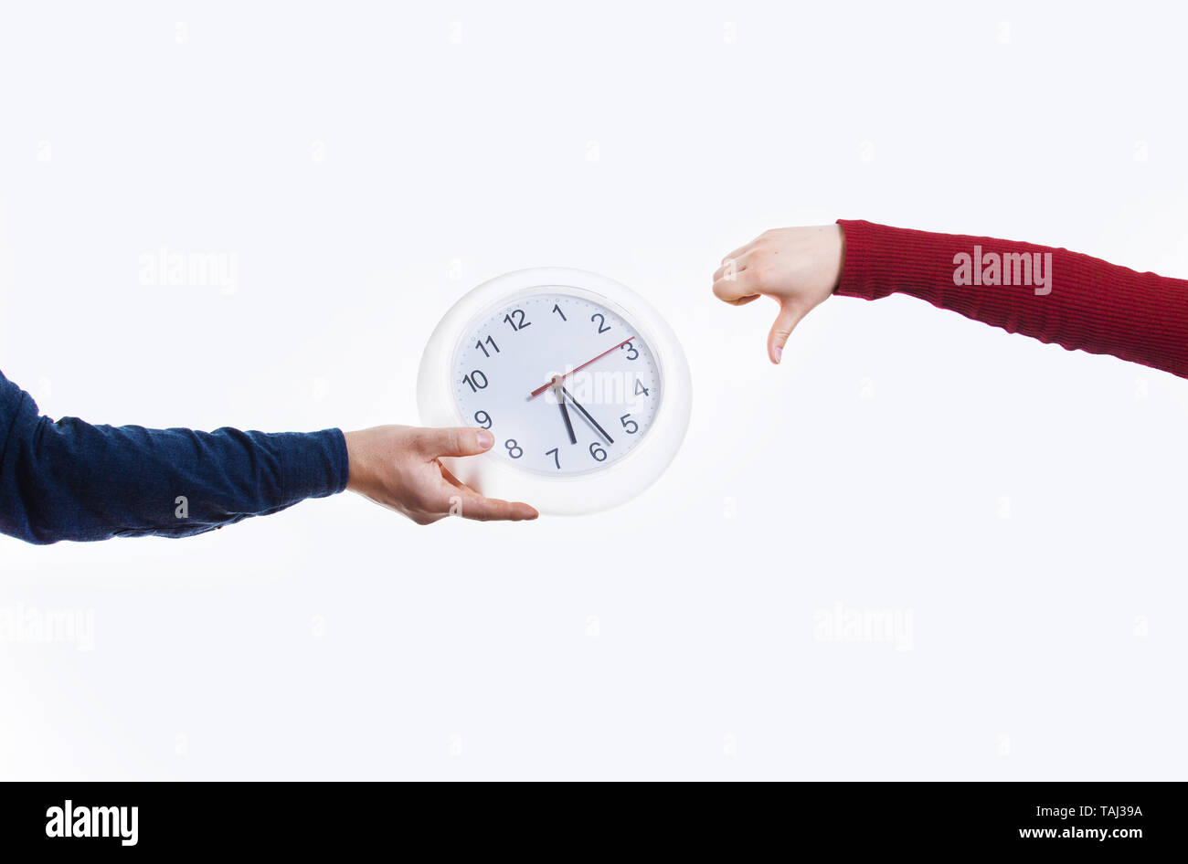 Man giving a clock to a woman with a thumb down gesture. Time ...