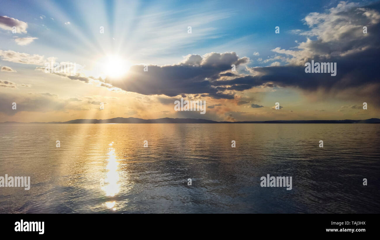Sun sunset reflected on sea hi-res stock photography and images - Alamy