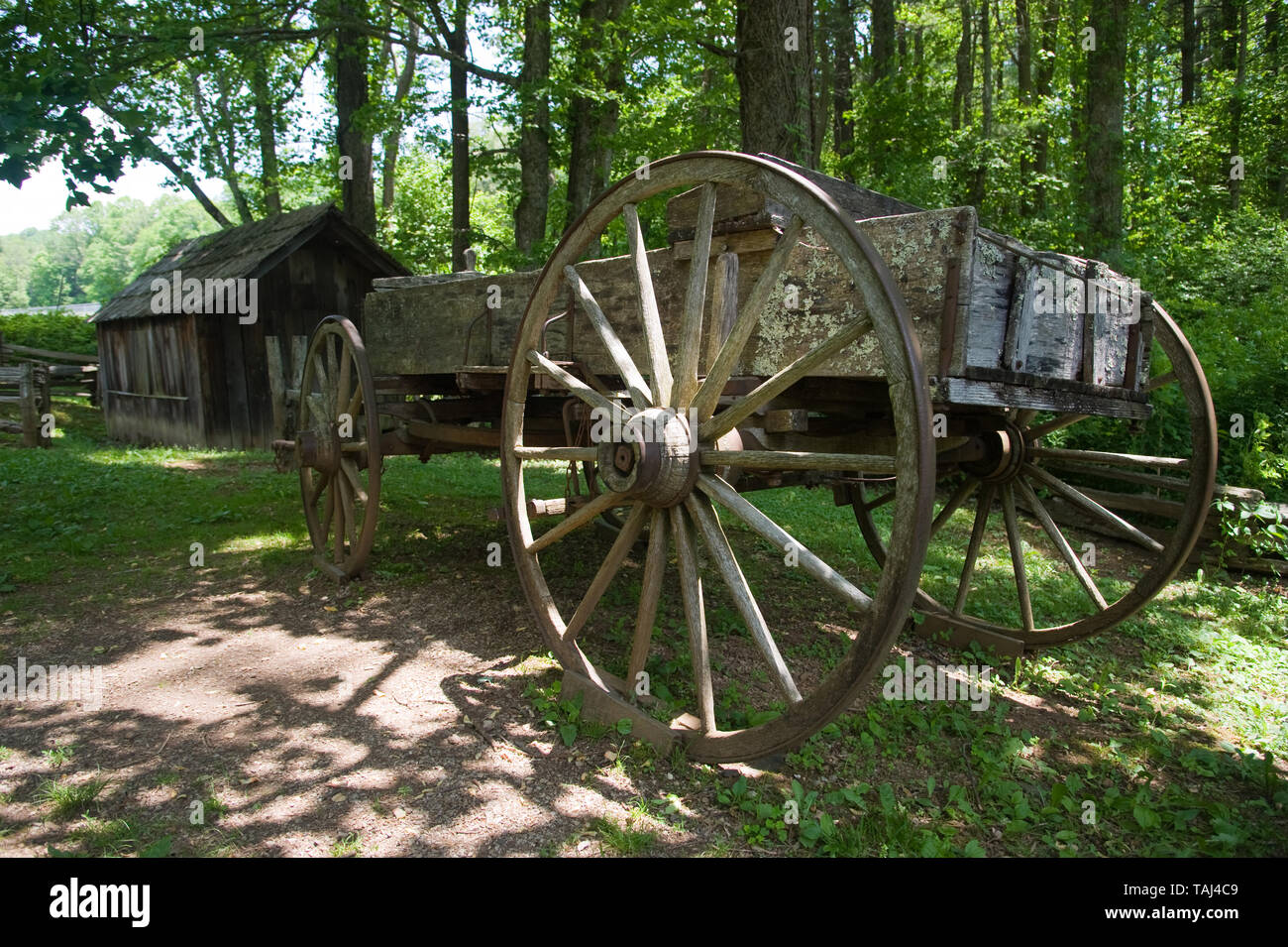 Wooden horse wagon next to a barn of a homestead in the USA Stock Photo ...