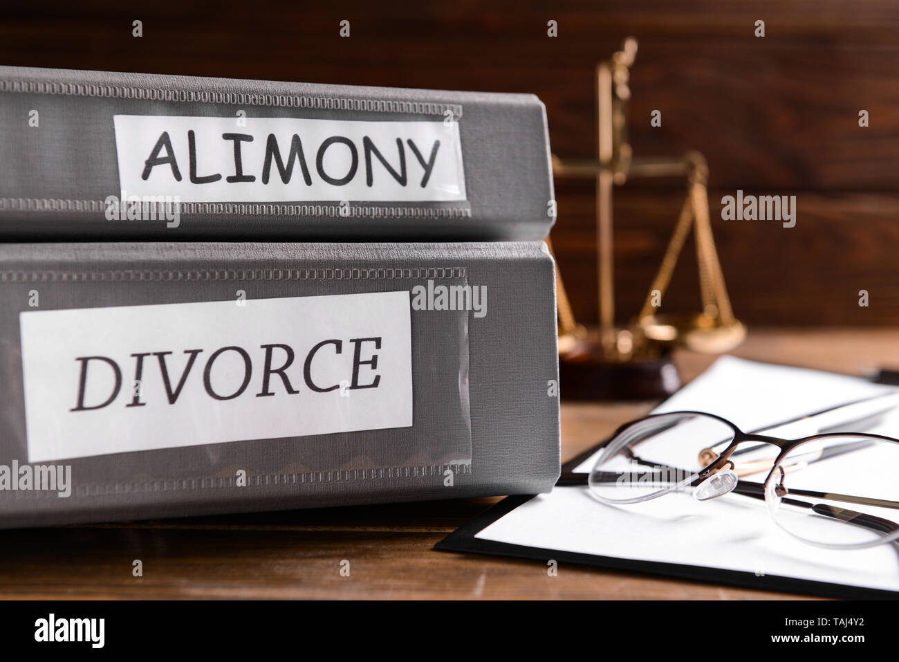 Folders with text ALIMONY and DIVORCE on judge's table Stock Photo - Alamy