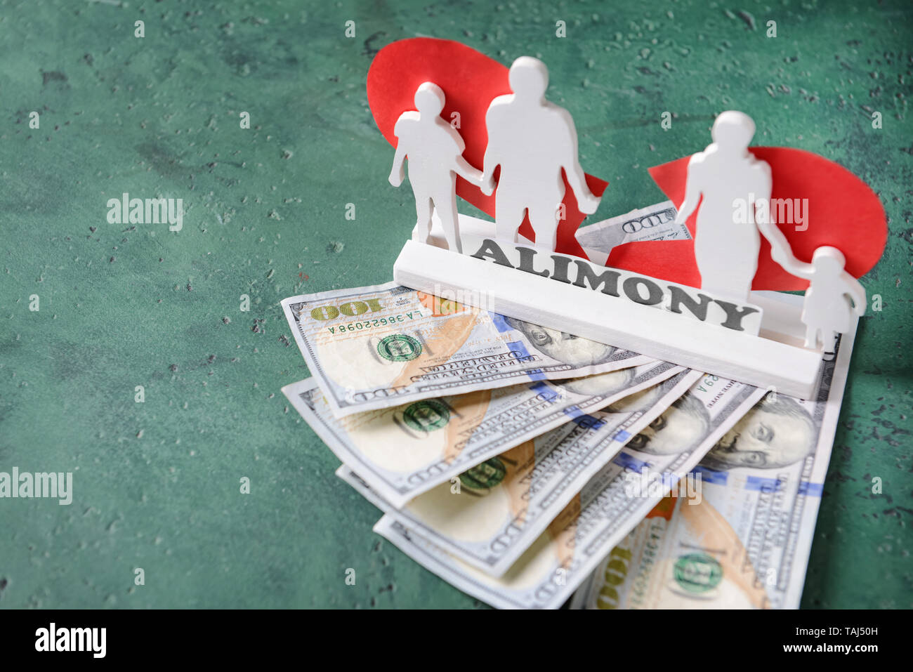 Composition with figure of family, money and paper with text ALIMONY on ...
