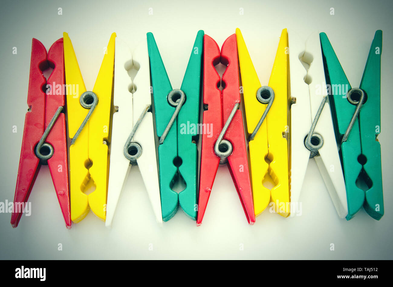 colorful clothes pegs in a row Stock Photo - Alamy