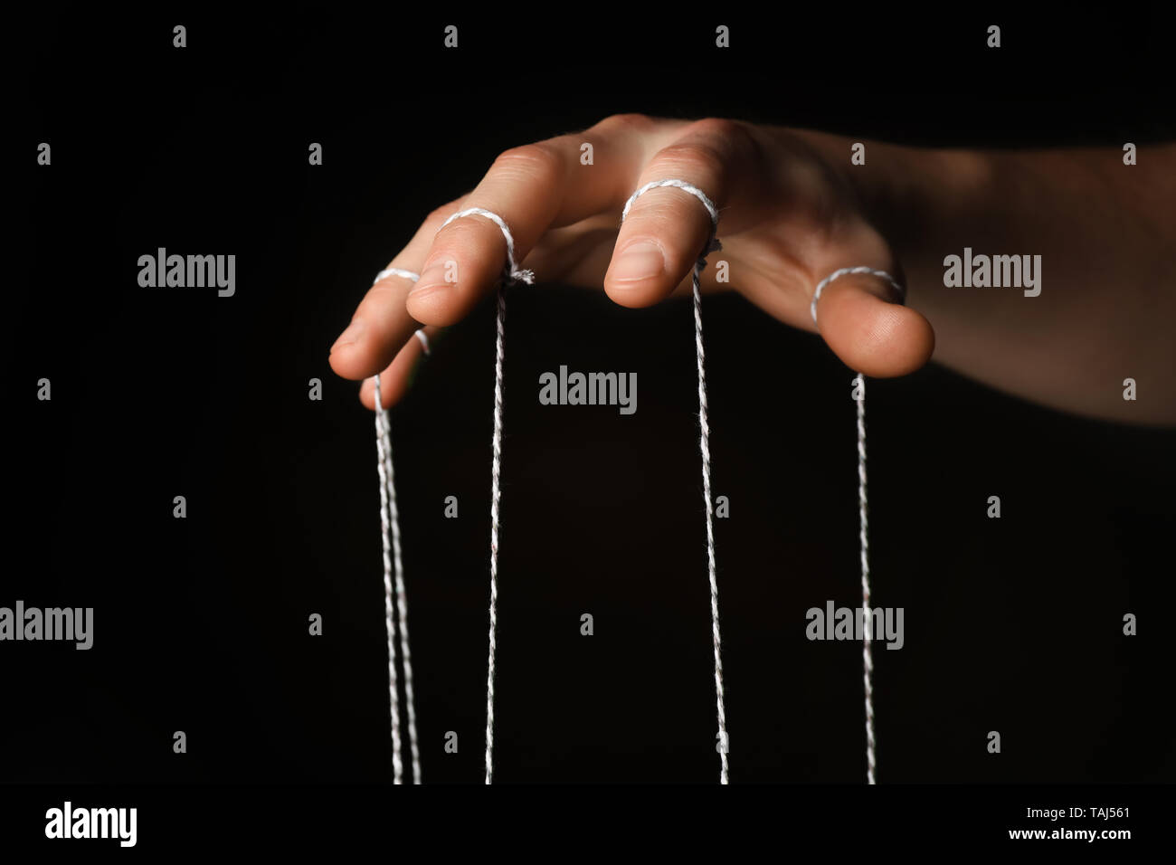 Man hand puppet strings hi-res stock photography and images - Alamy
