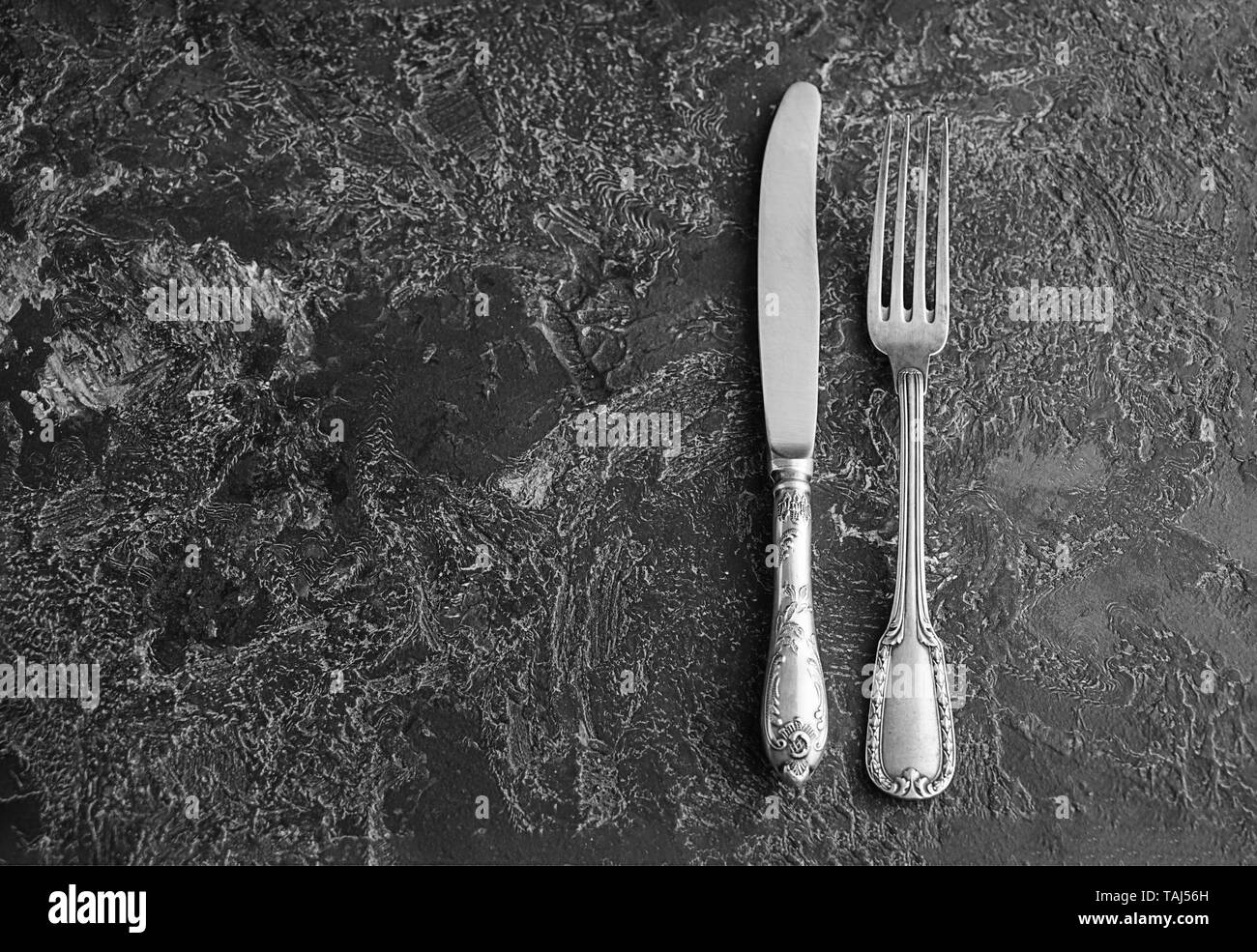 Silver cutlery on grunge hi-res stock photography and images - Alamy