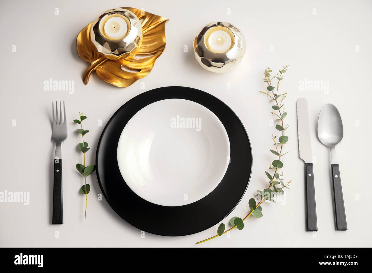 Simple table setting on white background Stock Photo - Alamy