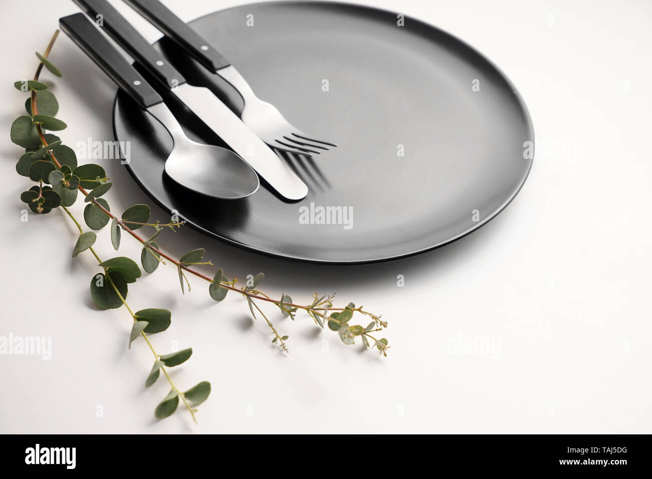 Simple table setting on white background Stock Photo - Alamy