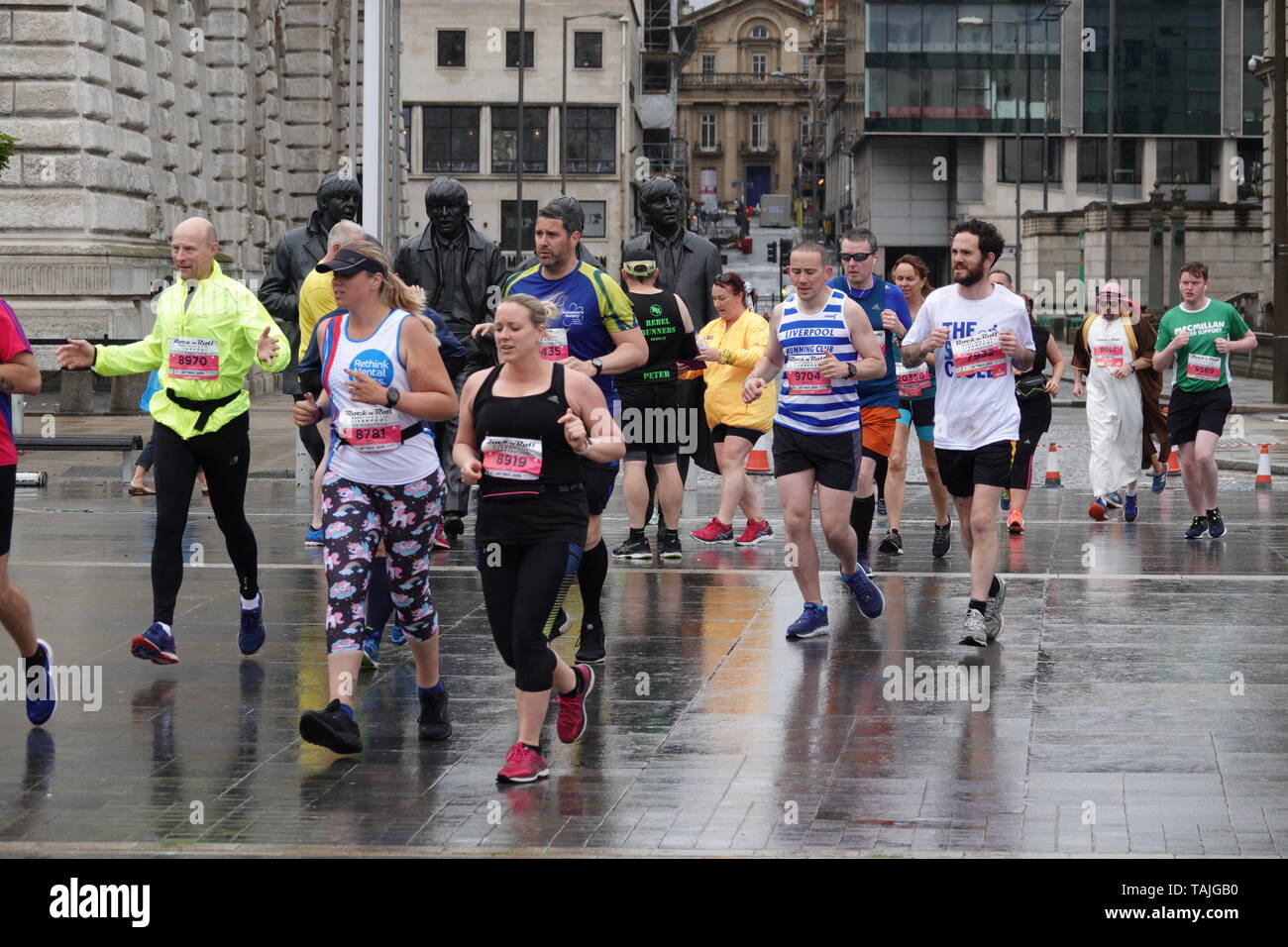 Liverpool, UK. 26th May 2019. Runners taking part in the Rock n Roll ...