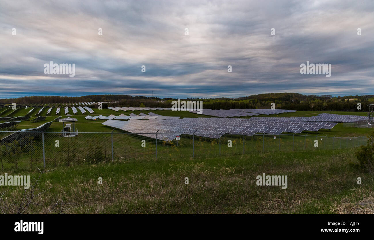Solar farm featuring array of several solar panels Stock Photo - Alamy