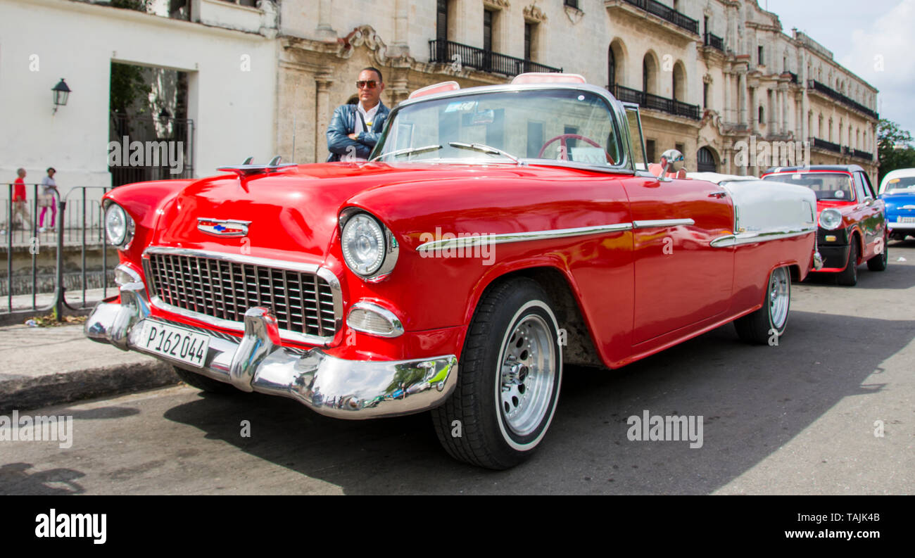 Havana, Cuba - Taxis wait for fares near Plaza de la Catedral. Classic ...