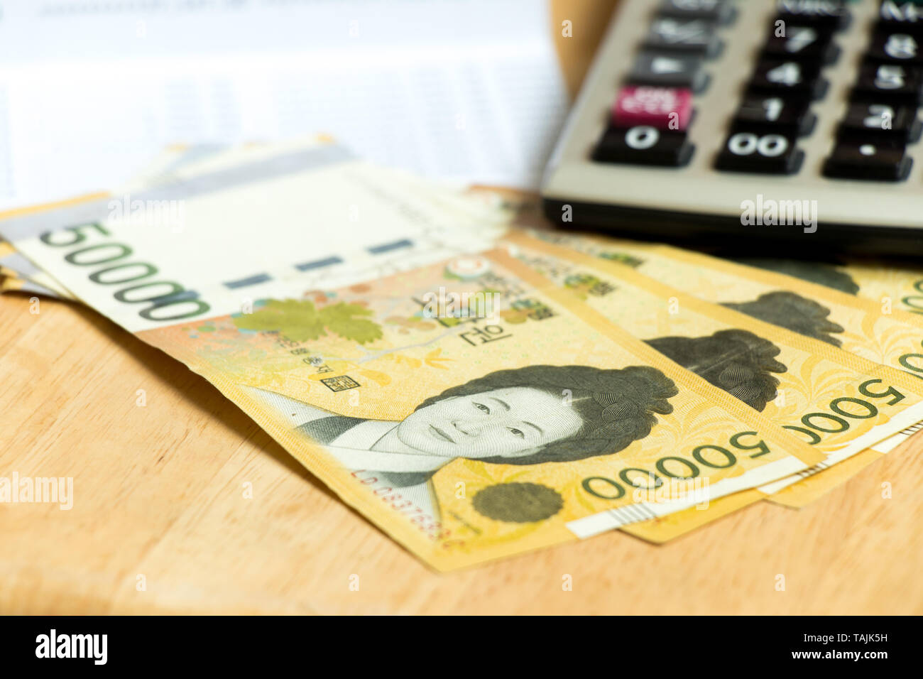 Blank note book with pen, calculator and south korea won (krw) banknote ...