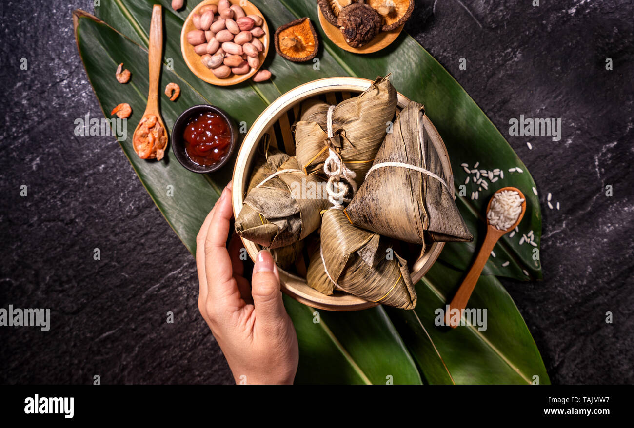 Zongzi, delicious fresh hot steamed rice dumplings in steamer. Close up ...