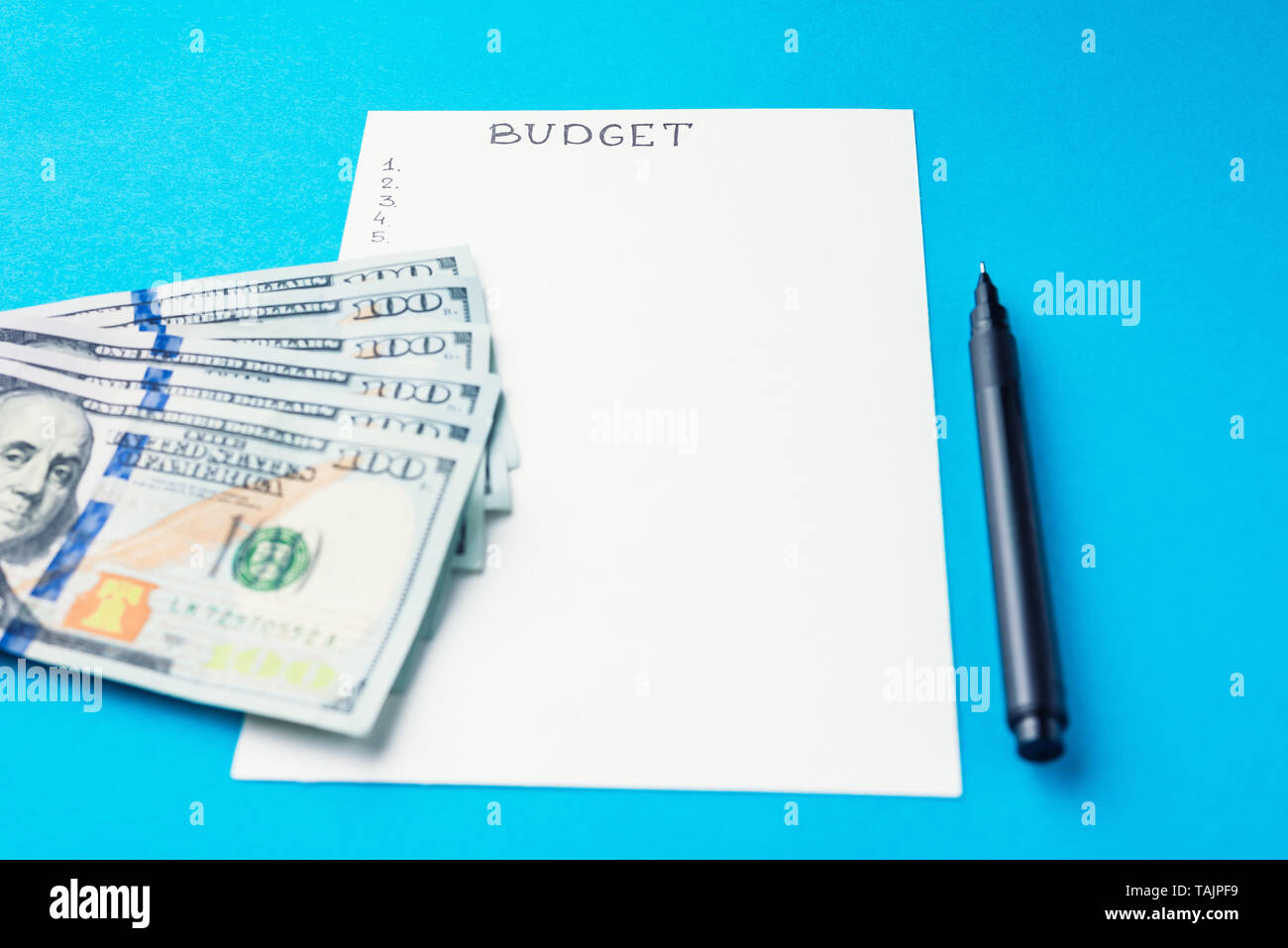 Planning budget concept. Notepad with word budget and dollar bills on ...