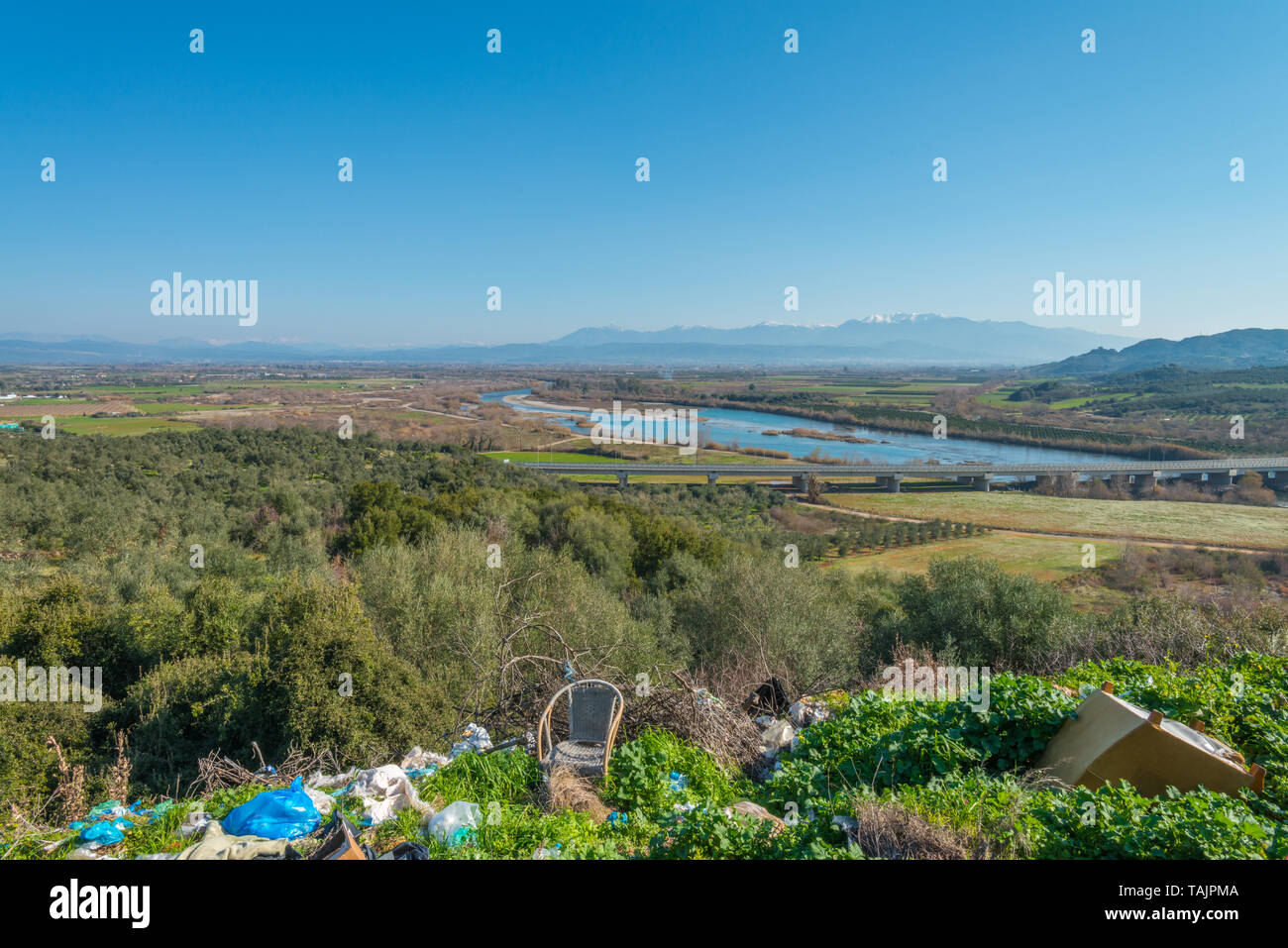 Roadside garbage on a beautiful viewpoint over a mountainous valley in ...