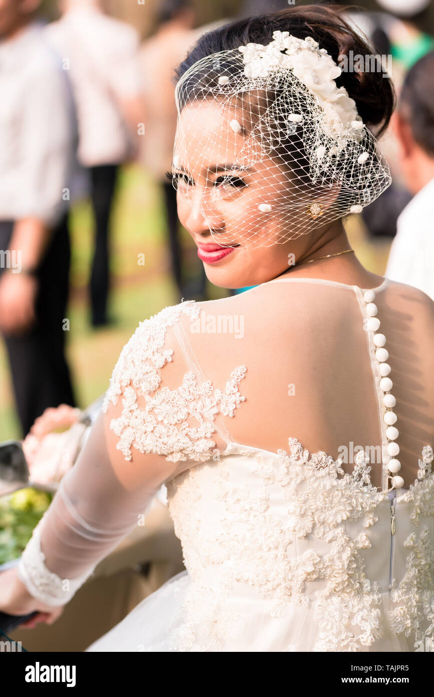 Happy Indonesian bride on her wedding looking into camera Stock Photo ...