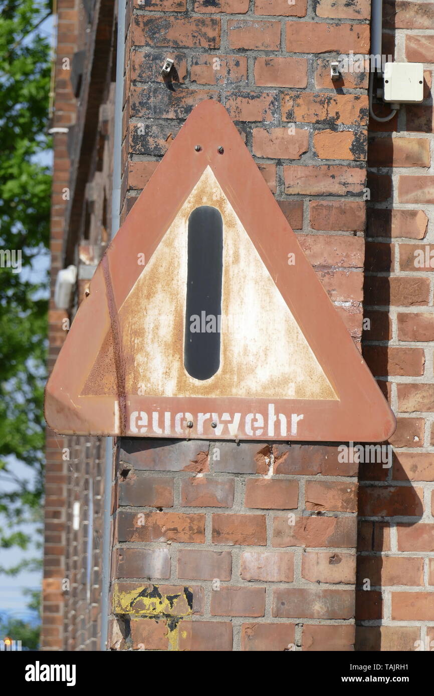 Old rusted road sign. Hazard spot, fire department Stock Photo - Alamy