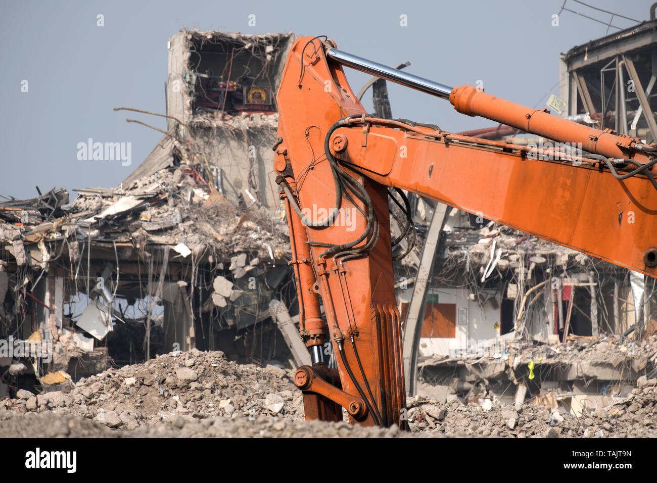 Big demolition machine demolishing a factory Stock Photo - Alamy