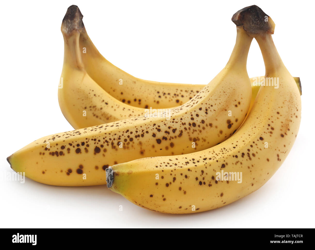 Over ripe spotted banana over white background Stock Photo - Alamy
